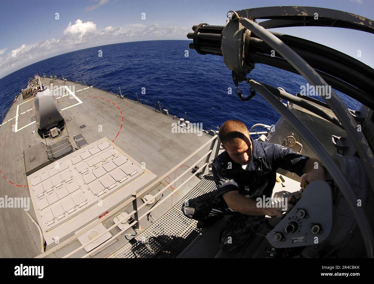US Navy Fire Controlman 2nd Class conducts maintenance on the forward ...
