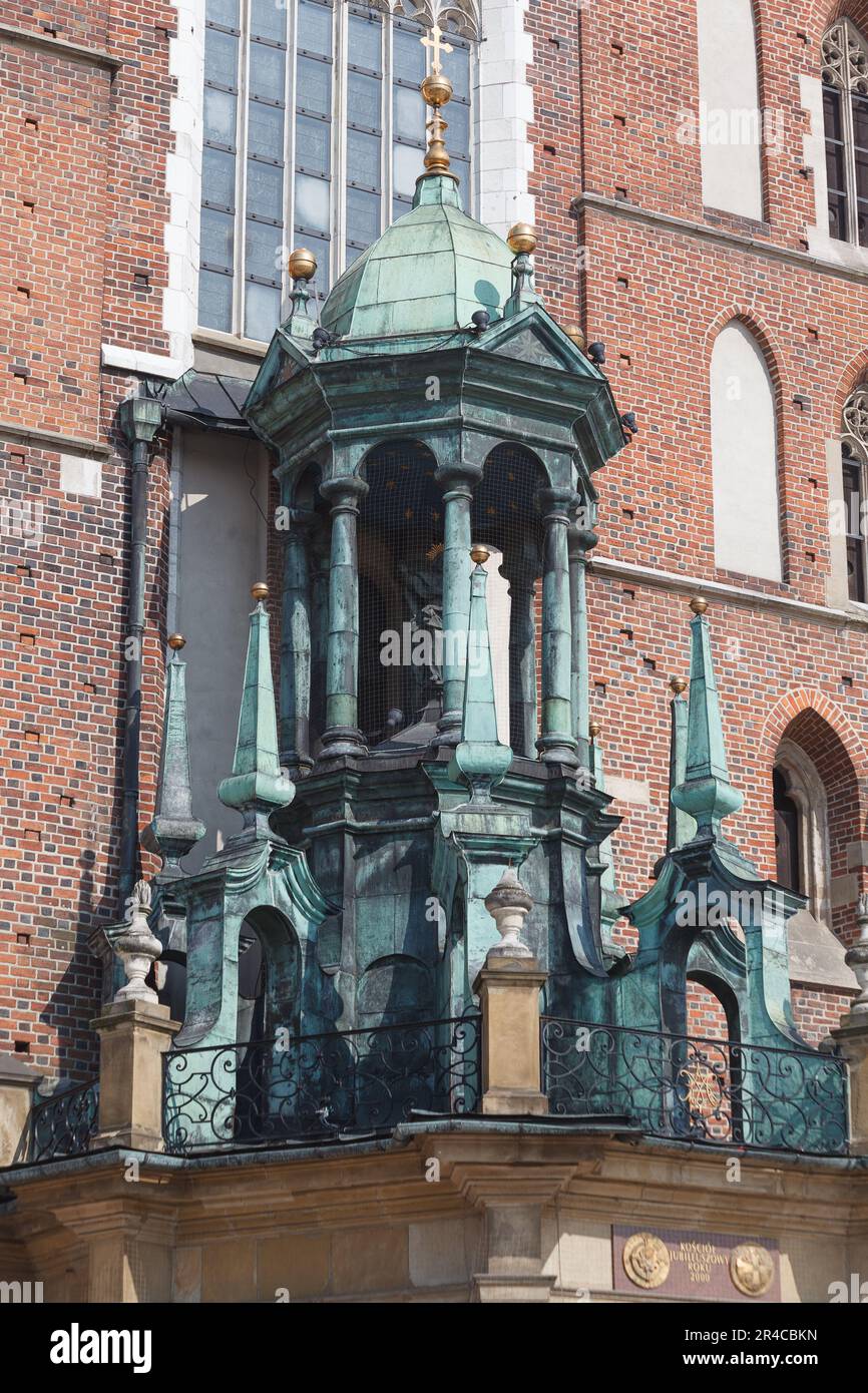 A gothic architecture of a Catholic church with a gold cross atop its ...