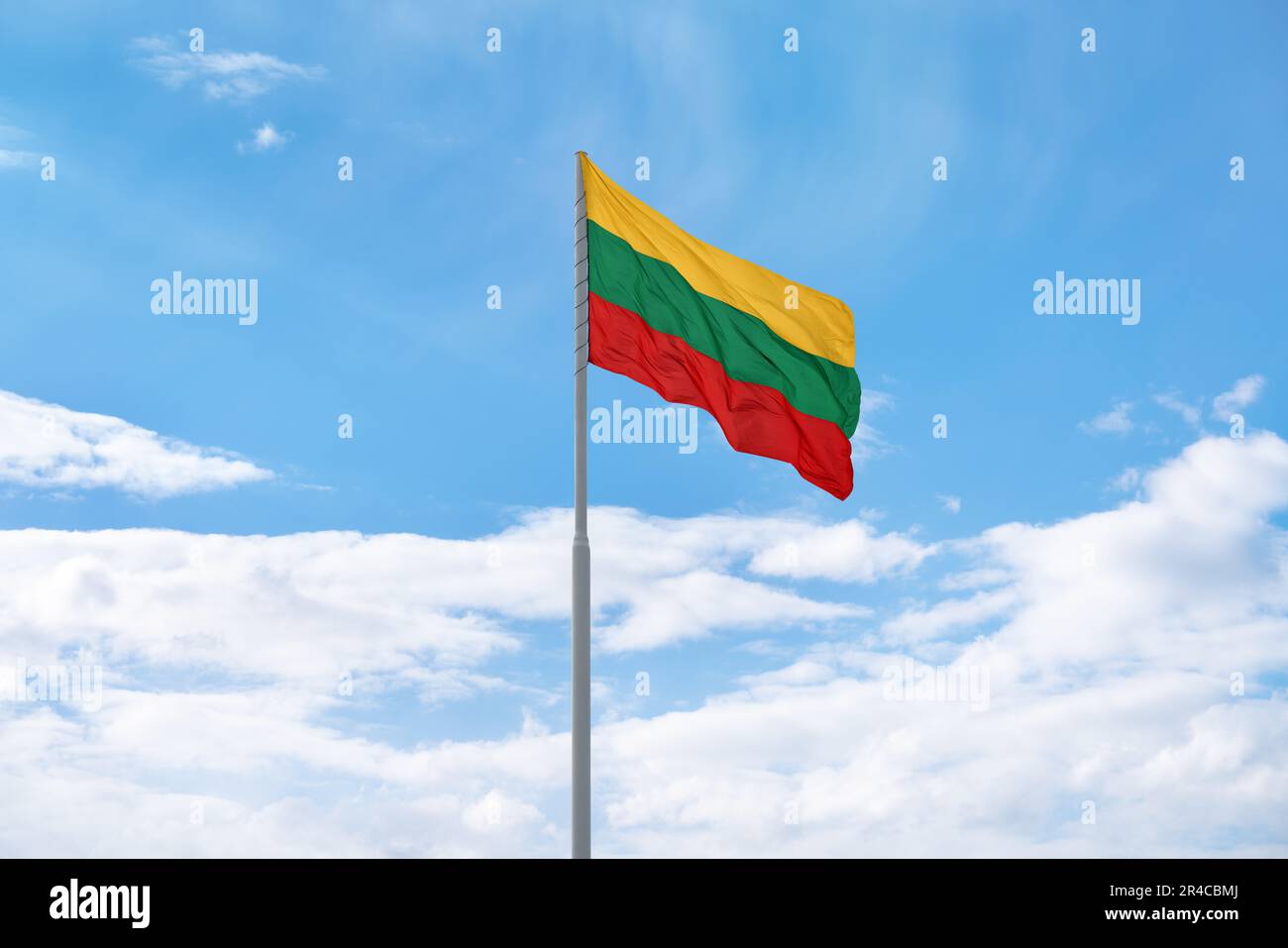 Flag of Lithuania is waving in front of blue sky and clouds Stock Photo ...