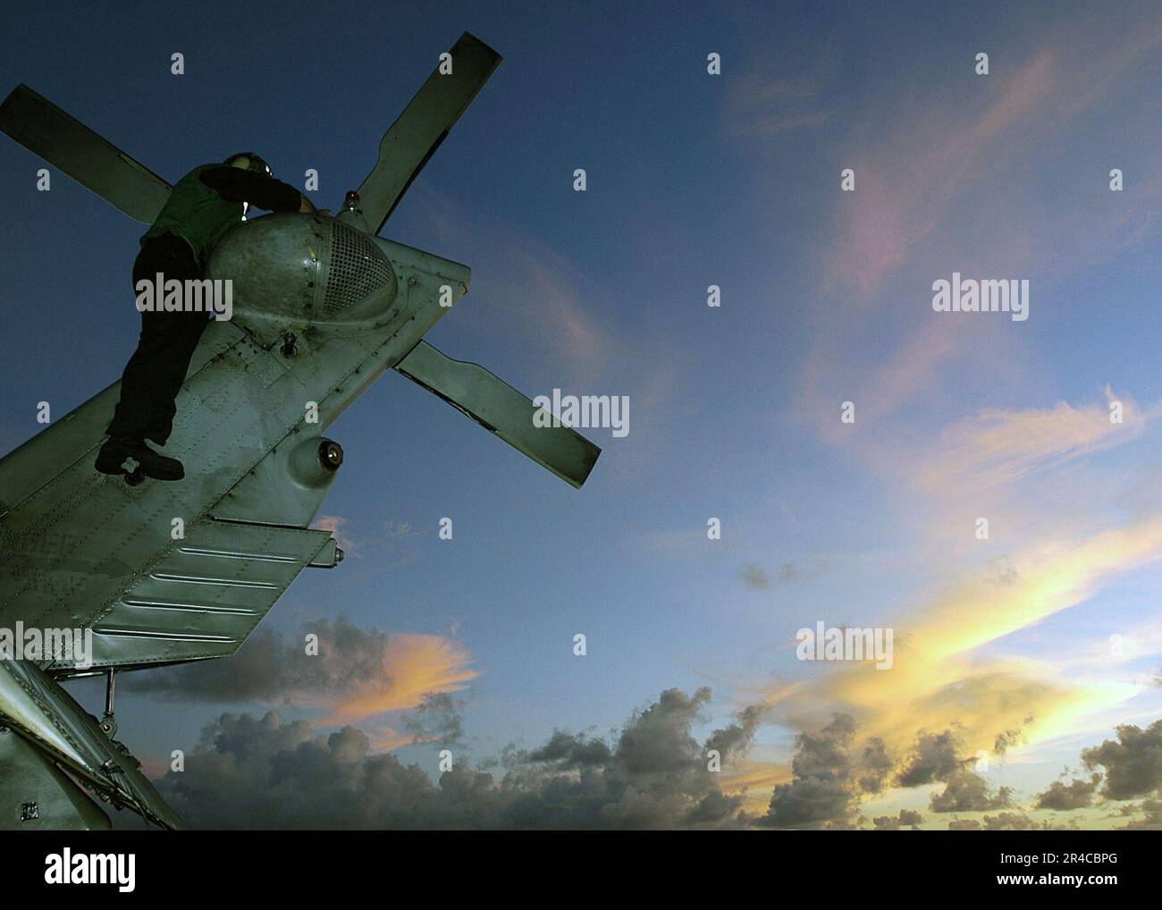 US Navy An airman stationed aboard the guided-missile destroyer USS ...