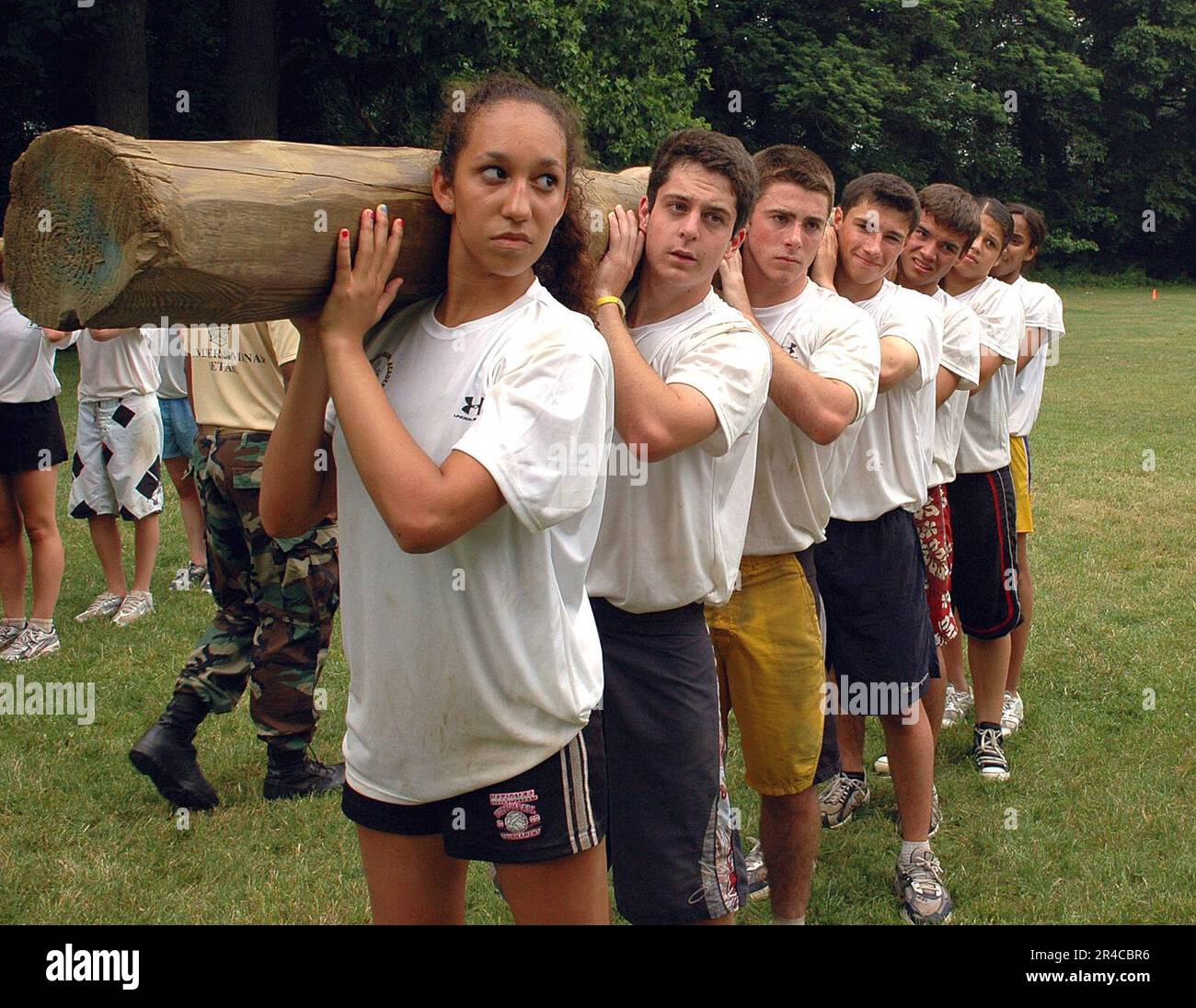 US Navy High school students participate in log PT as part of the U.S ...