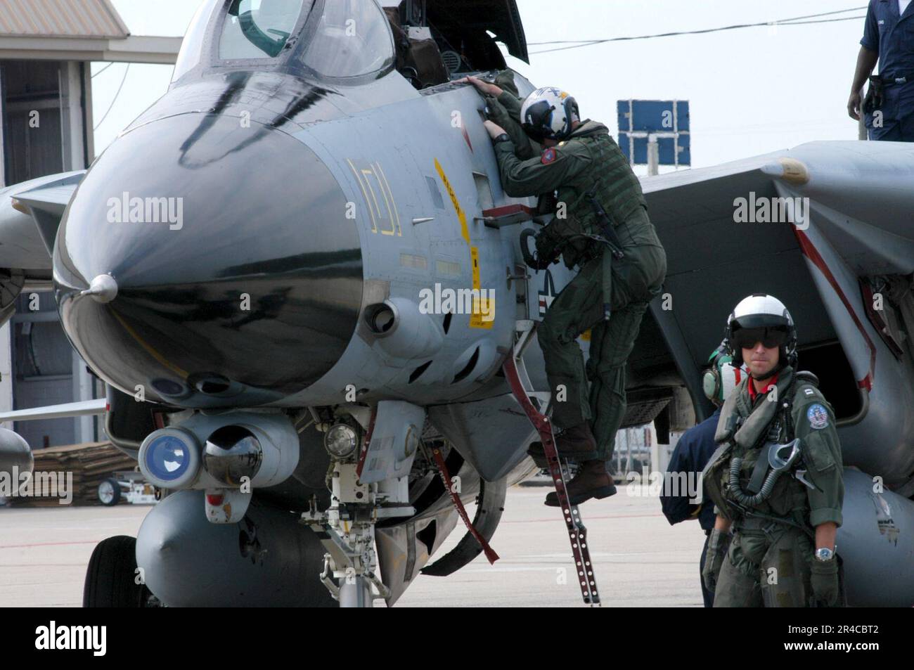 US Navy Lt. pilots with the Fighter Squadron three One (VF-31), exit an ...
