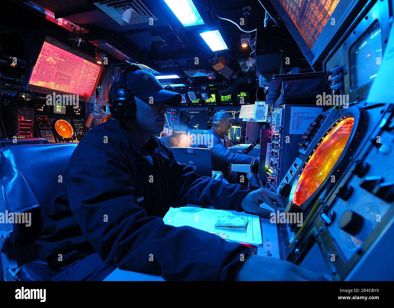 US Navy Operations Specialist 2nd Class stands watch in the Combat ...