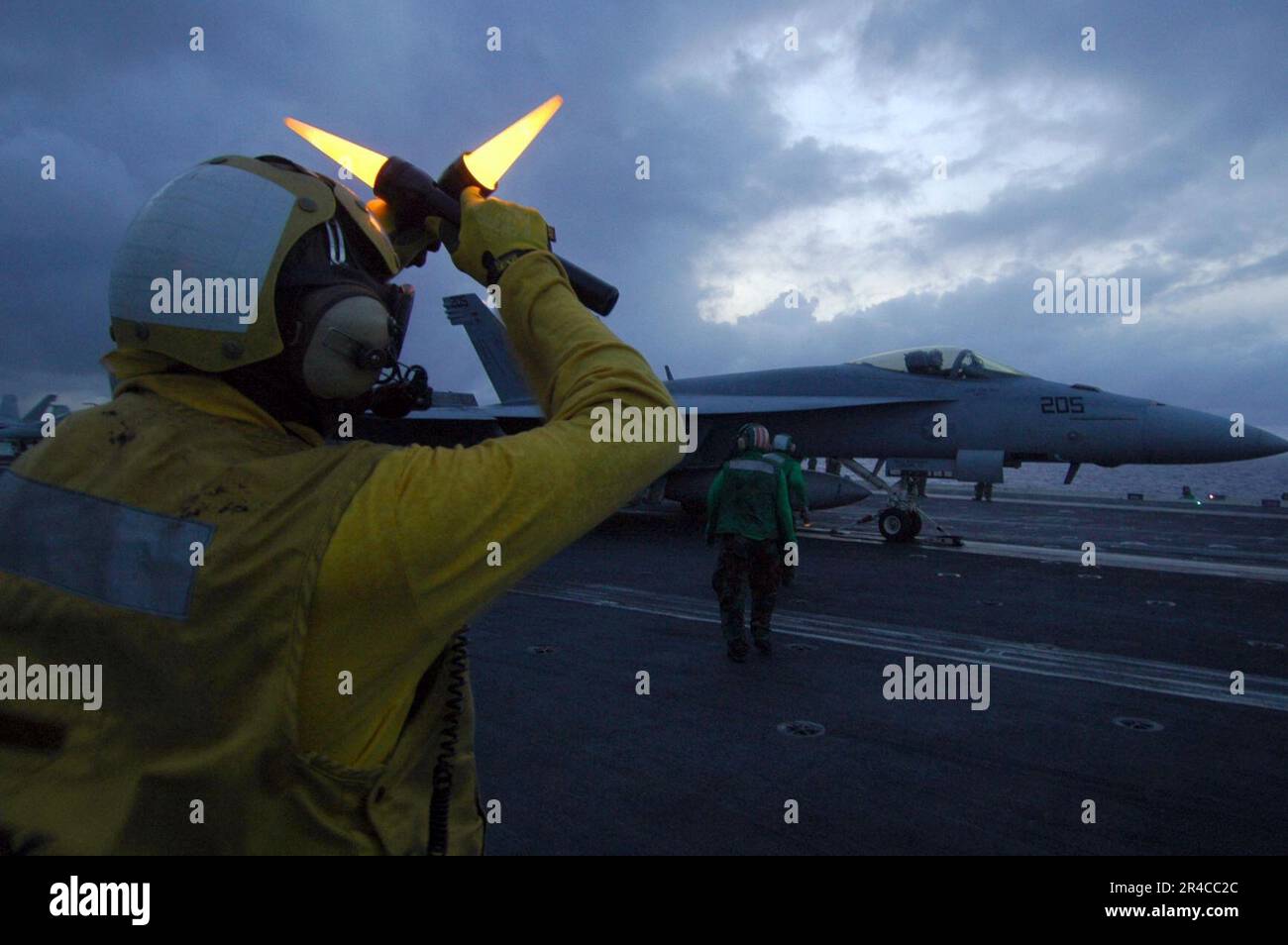 US Navy An aircraft director instructs the pilot of an F-A-18E Super ...