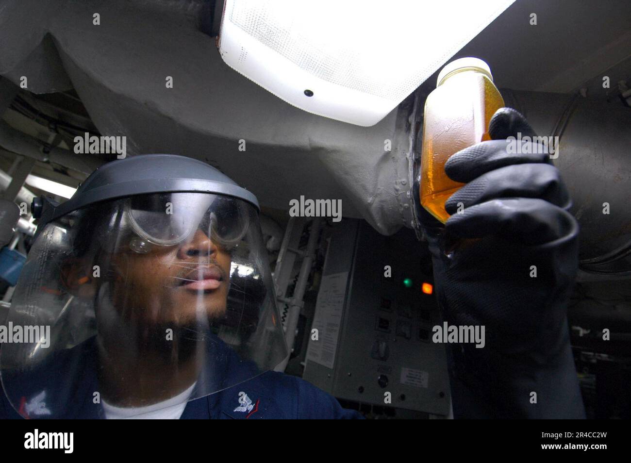 US Navy Gas Turbine Systems Technician 3rd Class inspects the quality ...