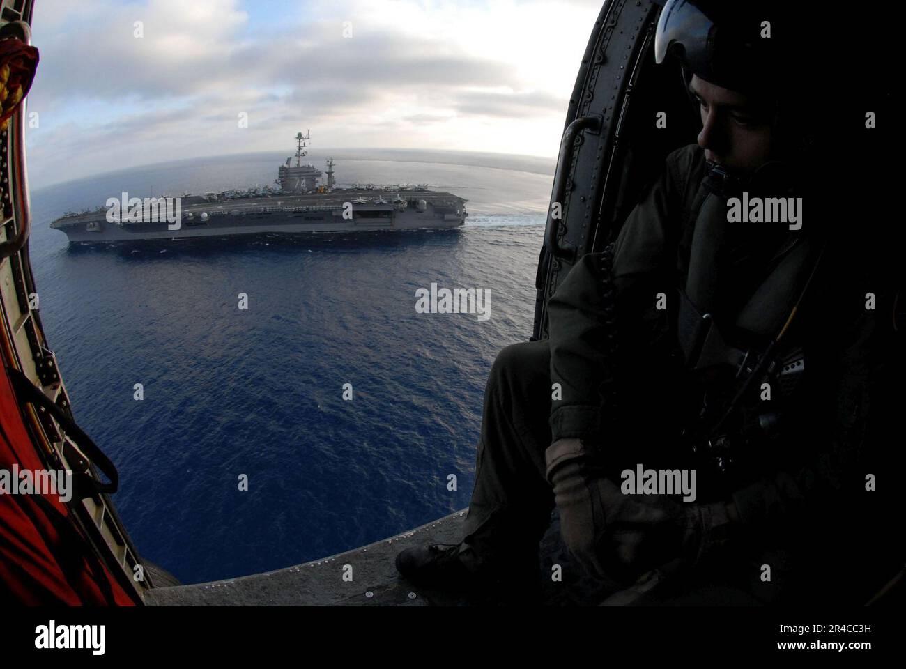 US Navy Aviation Warfare Systems Operator 2nd Class communicates with ...