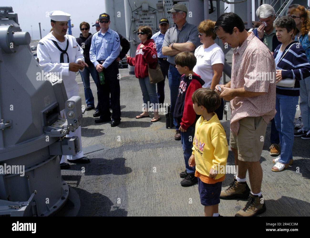 US Navy Gunner's Mate 3rd Class explains the MK-32 weapon system to a ...