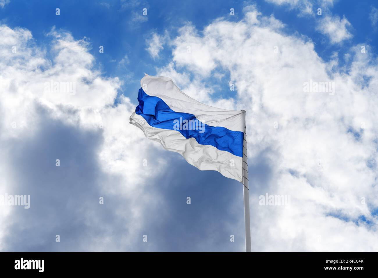 Russian white-blue-white anti-war protest flag is waving in front of ...
