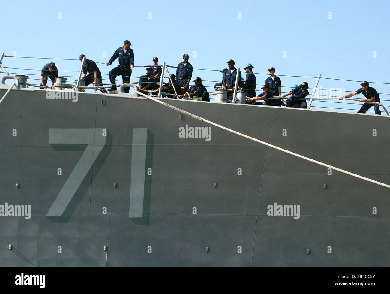 US Navy Crew members aboard the guided missile destroyer USS Ross (DDG ...