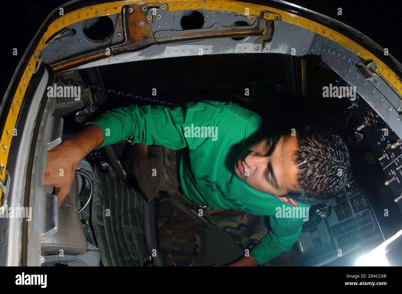 US Navy Aviation Structural Mechanic 3rd Class repairs a emergency ...