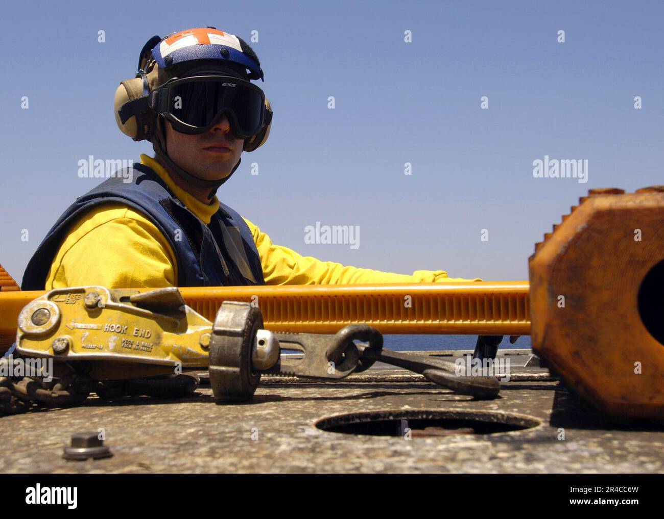 US Navy Aviation Boatswain's Mate Handler 3rd Class prepares to move an ...