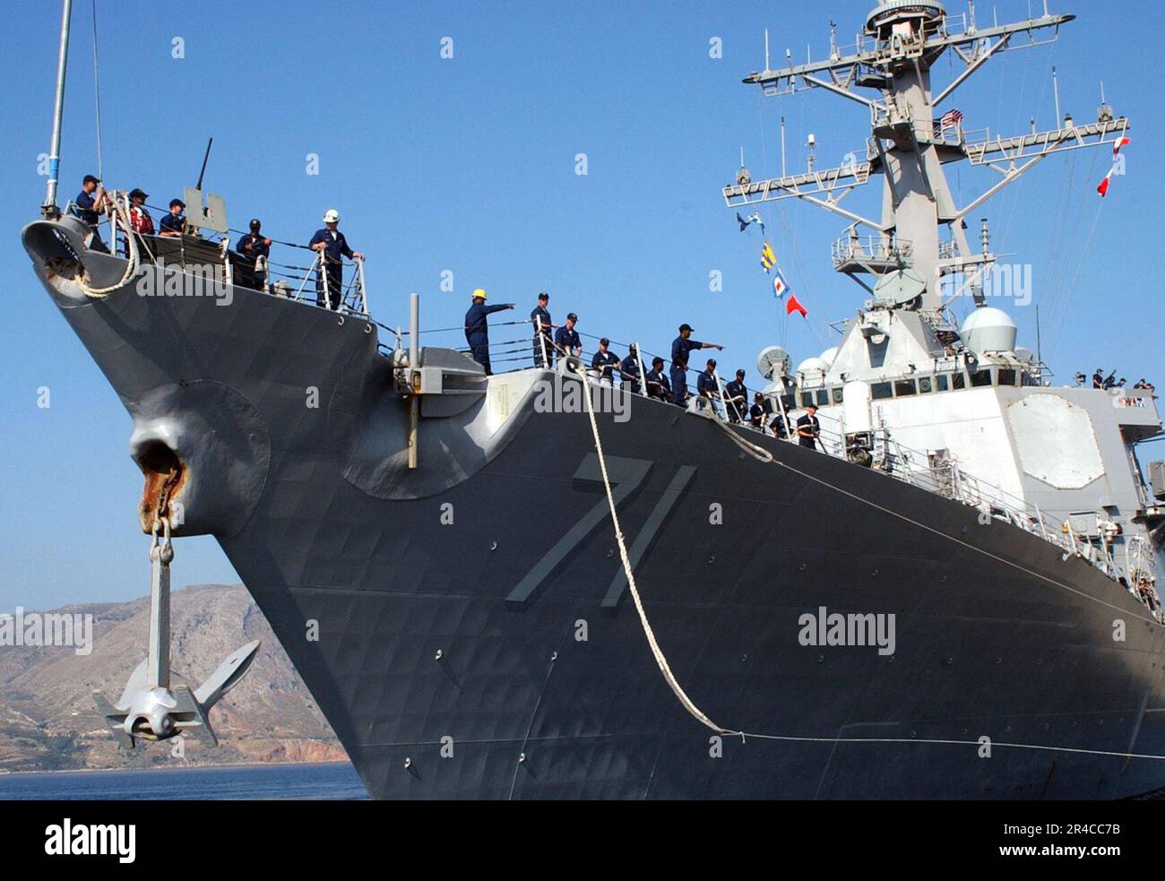 US Navy Crew members aboard the guided missile destroyer USS Ross (DDG ...