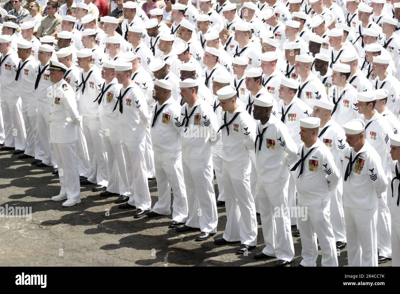 US Navy USS Lake Erie's (CG 70) crew stand at parade rest as Capt ...