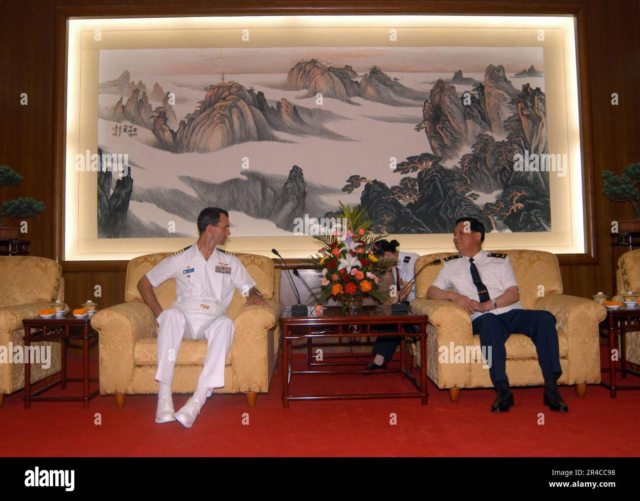 US Navy Shanghai Naval Base Commander, Rear Adm. Wang Deding, seated ...