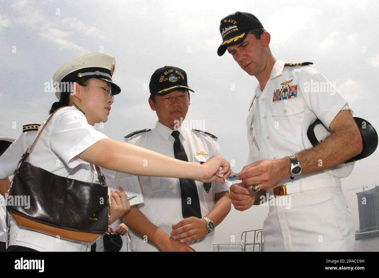US Navy Capt. presents a command coin to Commanding Officer, People's ...