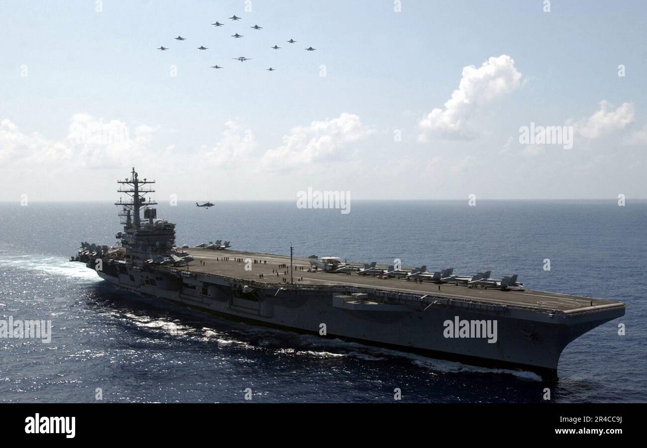 US Navy Carrier Air Wing Fourteen (CVW-14) passes over the Nimitz-class ...