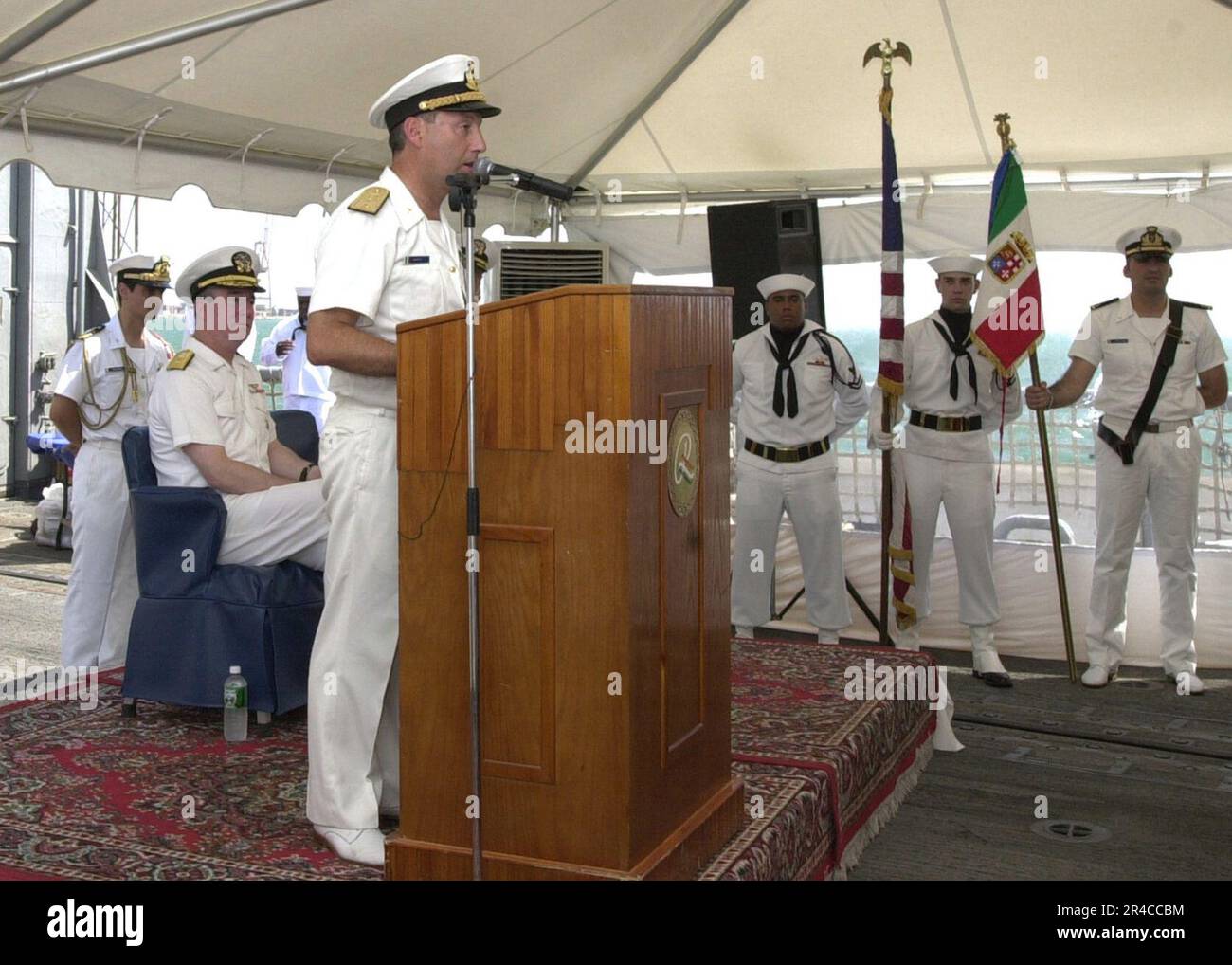 US Navy Commander, Italian Task Group, Rear Adm. addresses the audience ...