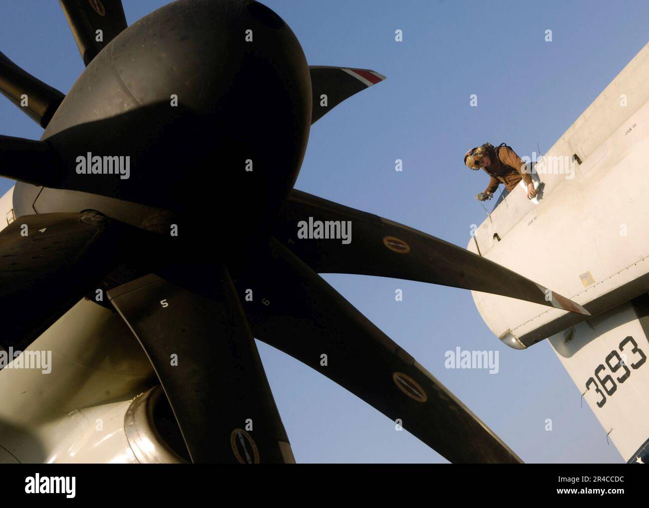 US Navy A Sailor assigned to the Screwtops of Carrier Airborne Early ...