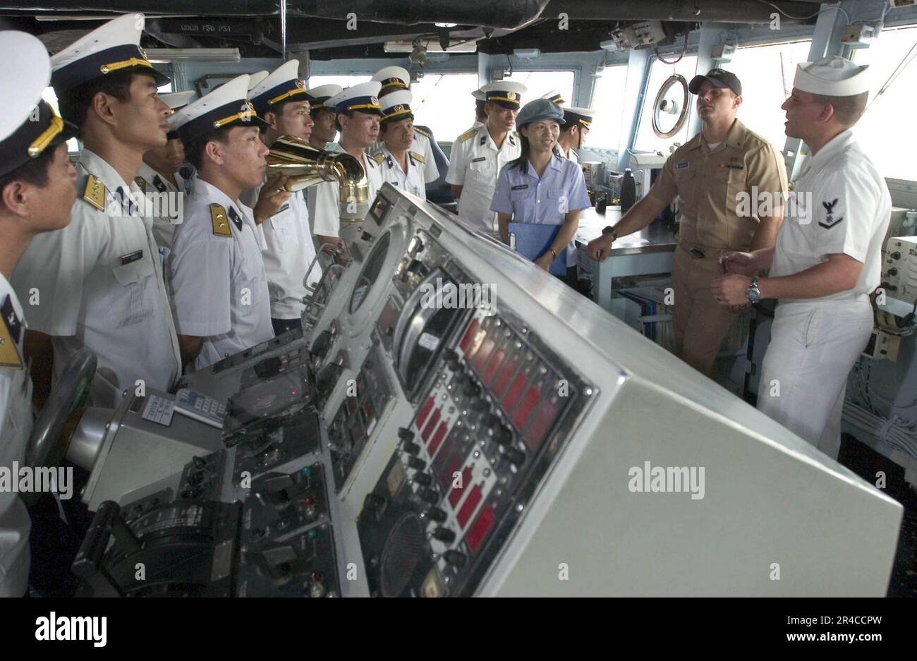 US Navy Quartermaster 3rd Class explains to visitors from the Navy ...