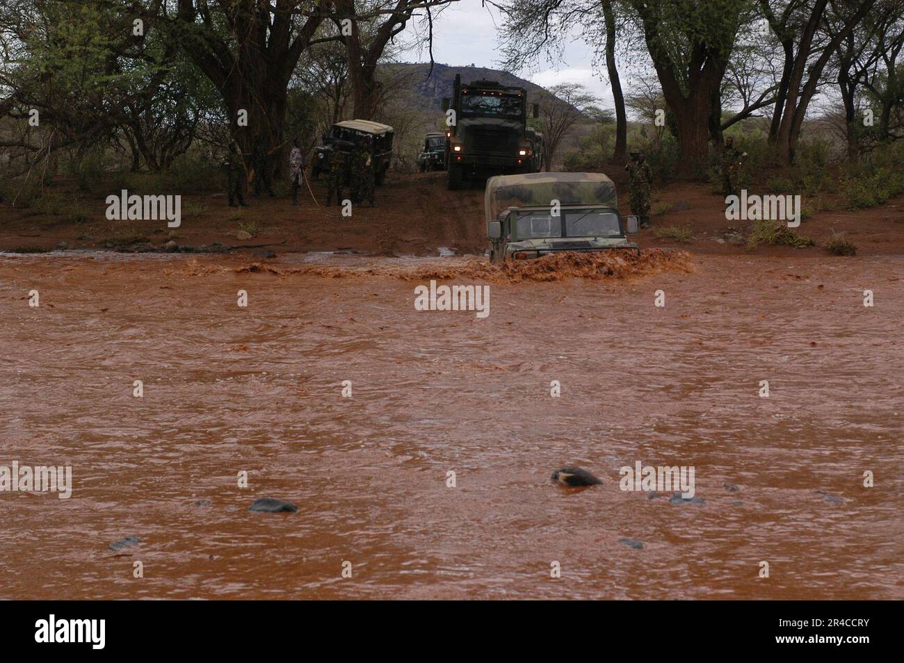 US Navy U.S. Marine Humvees and 7-Ton amphibious trucks powered through ...