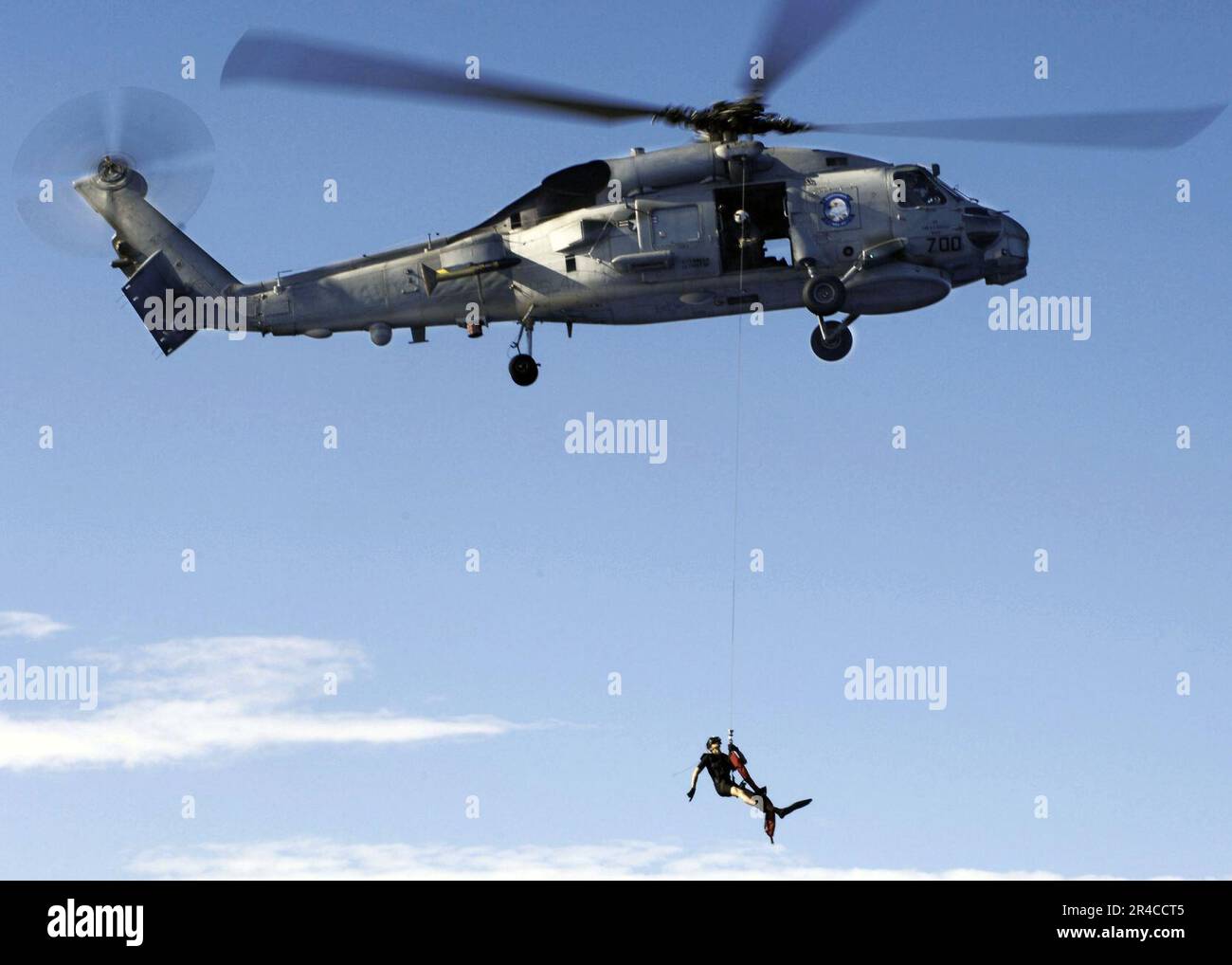 US Navy An SH-60B Seahawk helicopter assigned to HSL-47 lowers a rescue ...
