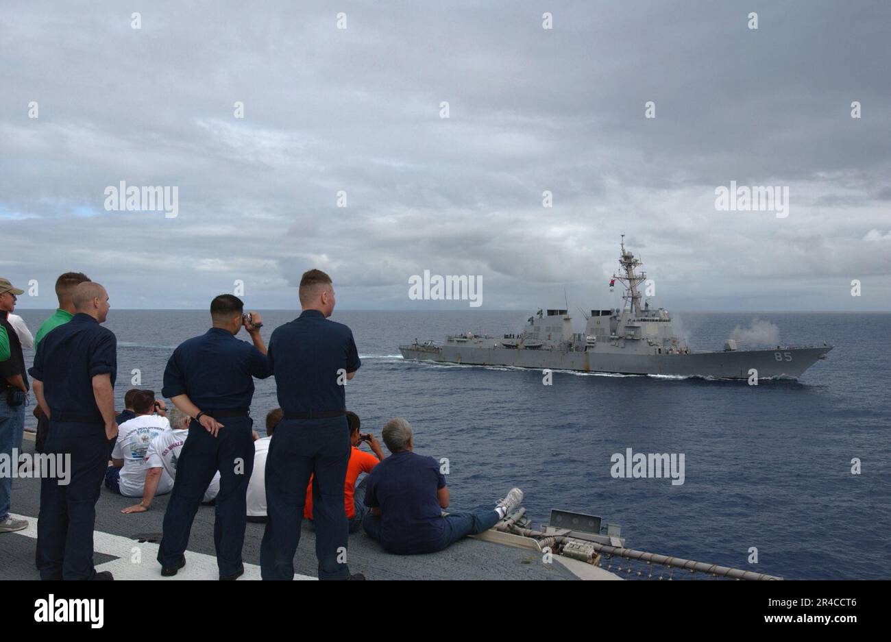 US Navy Sailors and their families crowd the Nimitz-class aircraft ...
