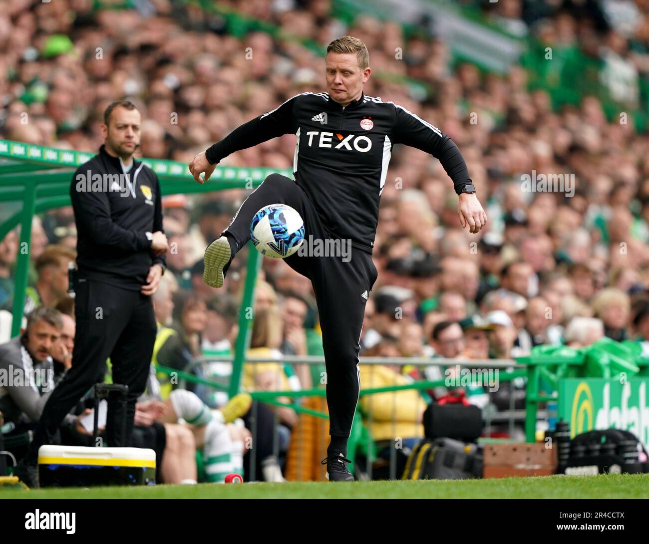 Aberdeen manager Barry Robson controls the ball on the touchline during ...