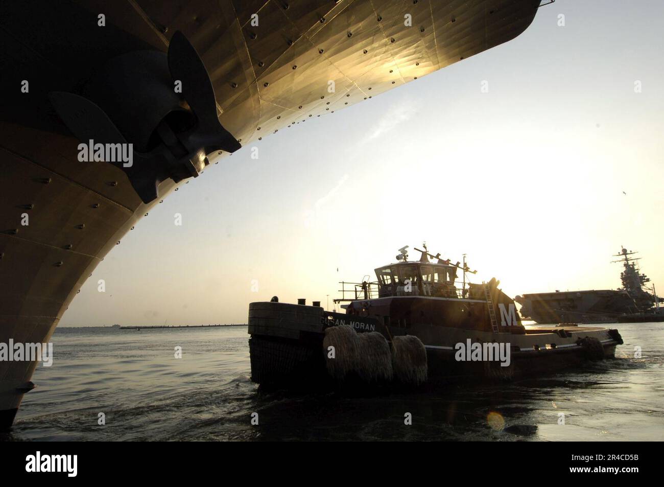 US Navy A tugboat assists the amphibious assault ship USS Bataan (LHD 5 ...