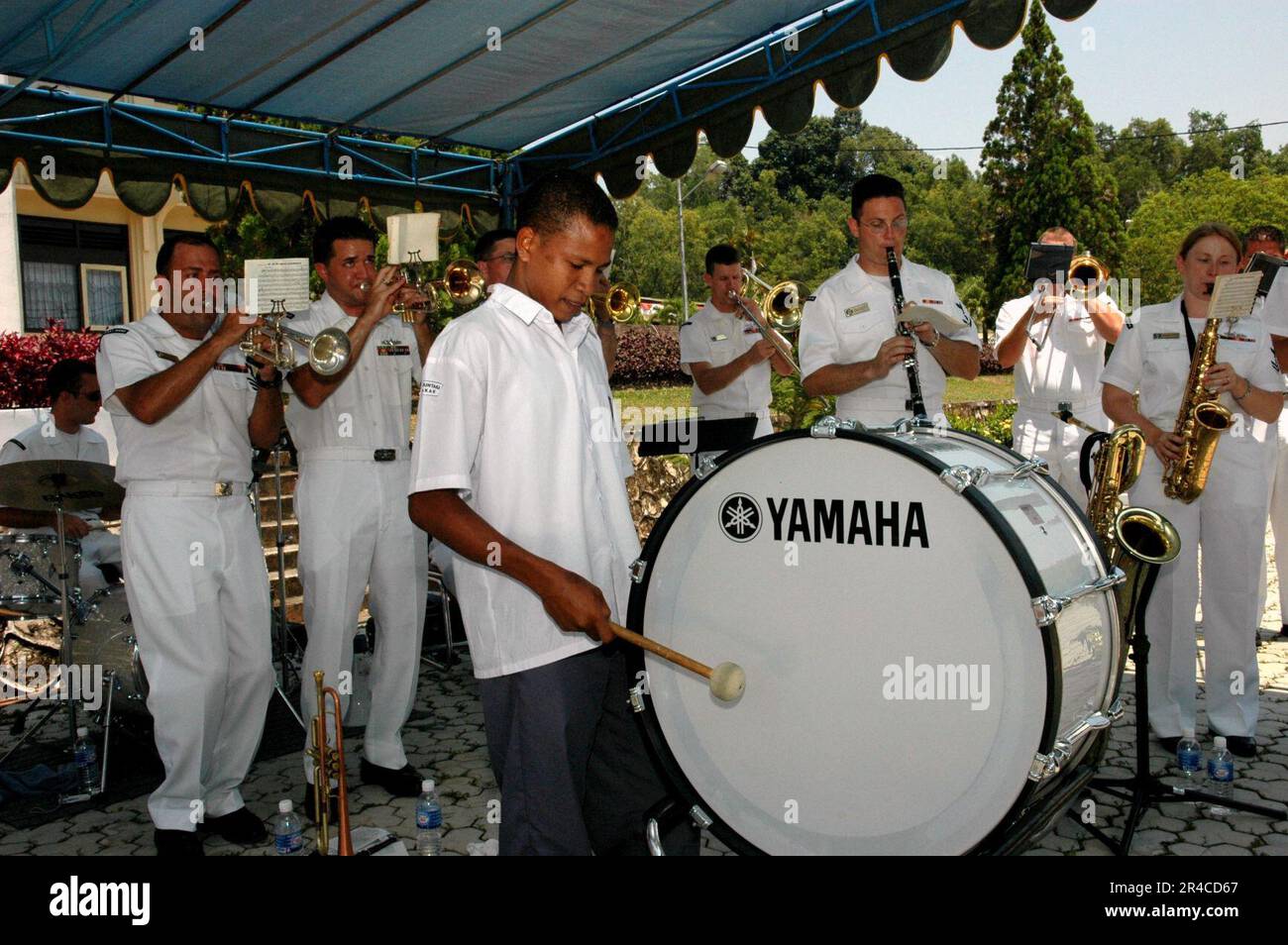 US Navy A local student performs as a guest drummer with the U.S. Navy ...