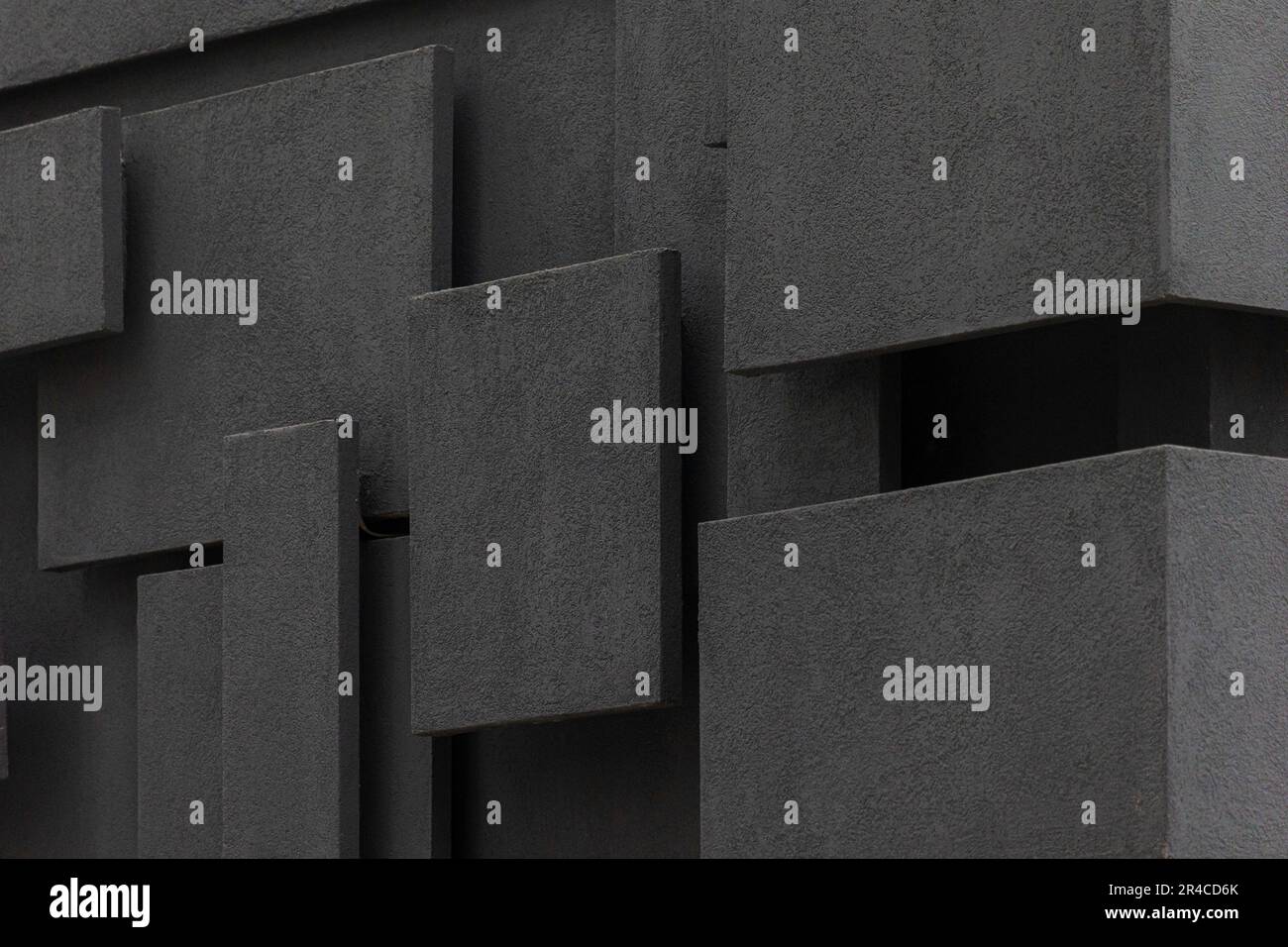 A tall, stately gray structure with a unique architectural design ...