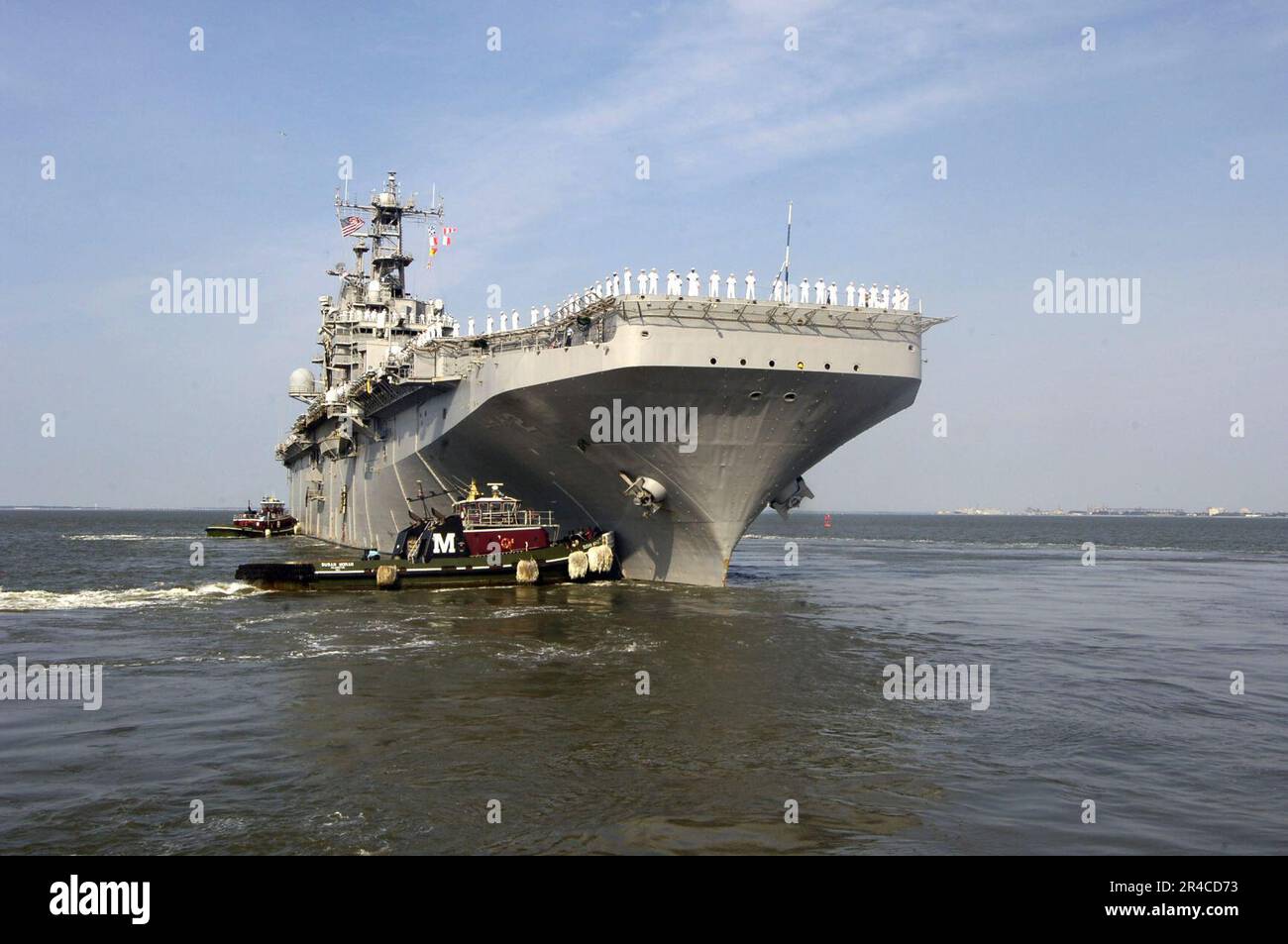 US Navy Tugboats assist the amphibious assault ship USS Saipan (LHA 2 ...