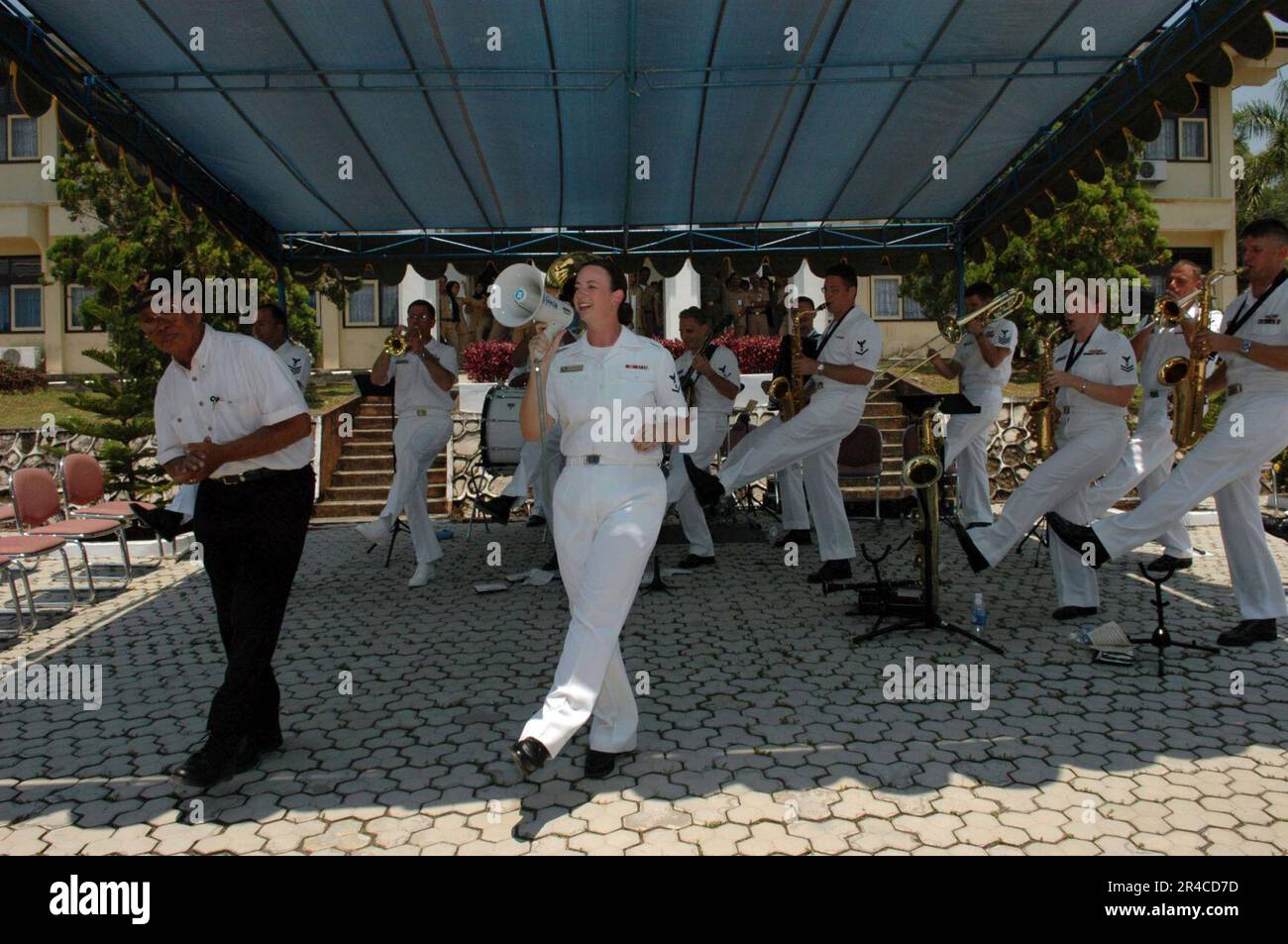 US Navy A local resident dances with the U.S. Navy Show Band, embarked ...