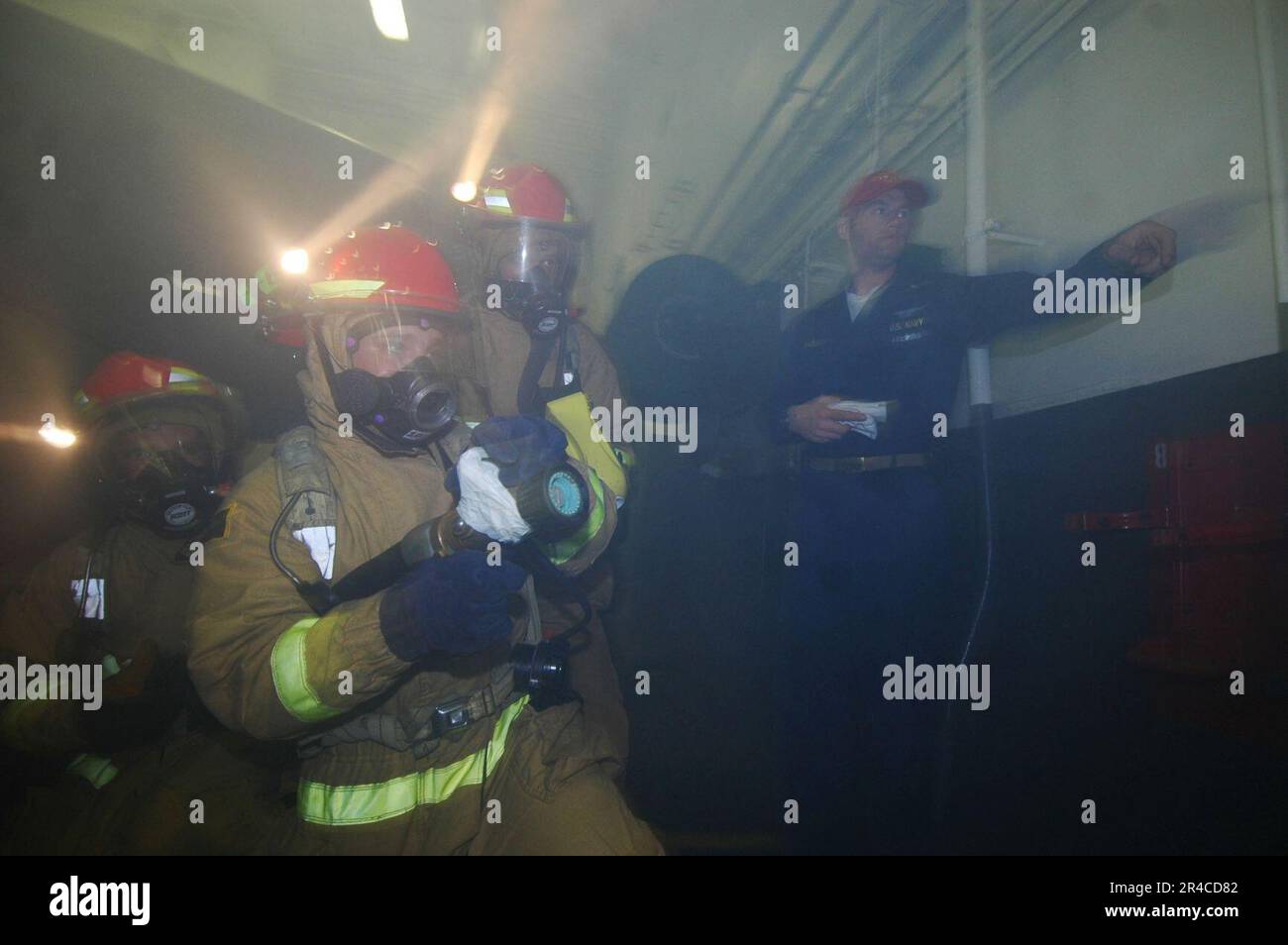 US Navy The Repair Locker 1B Hose Team battles a simulated hangar bay ...