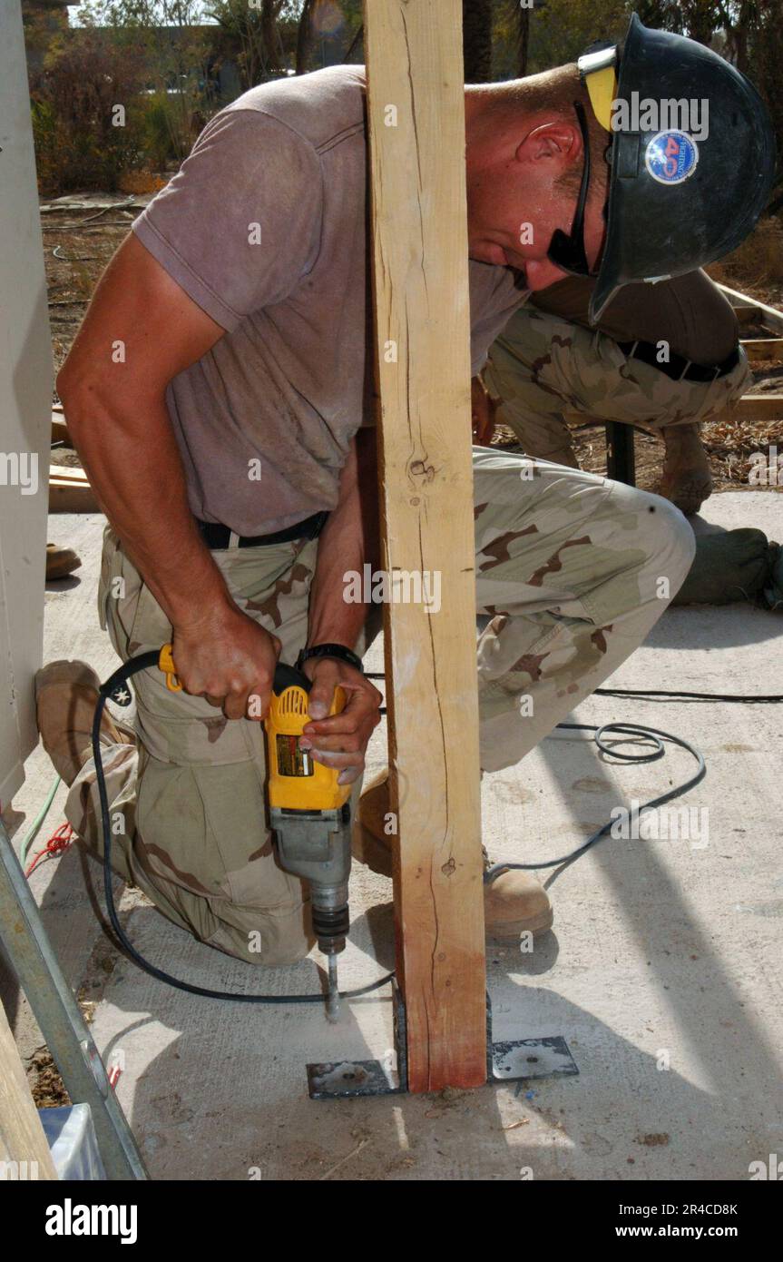 US Navy A Seabee assigned to Naval Mobile Construction Battalion Four ...