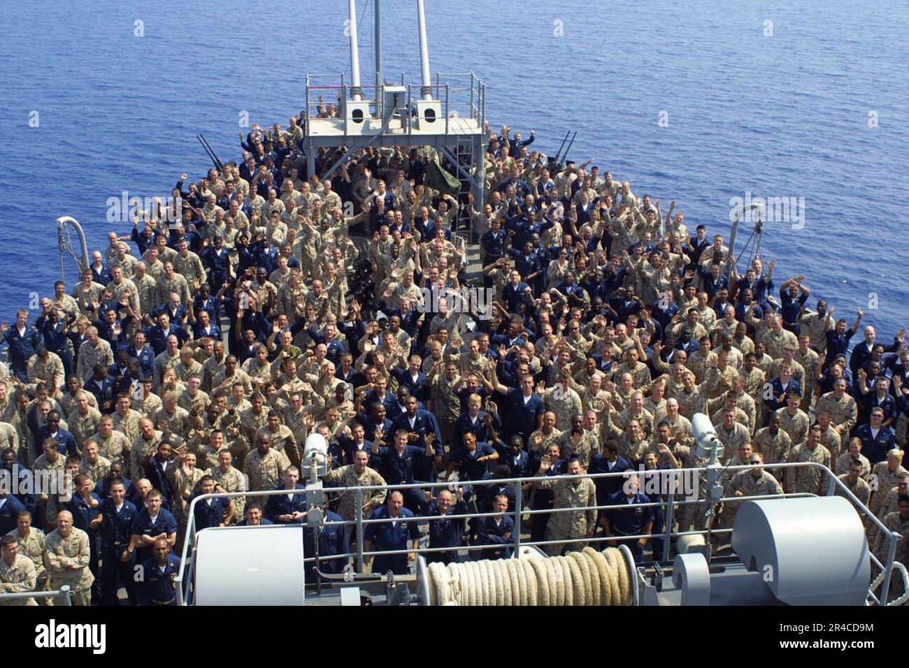 US Navy Sailors and Marines stationed aboard the amphibious transport ...