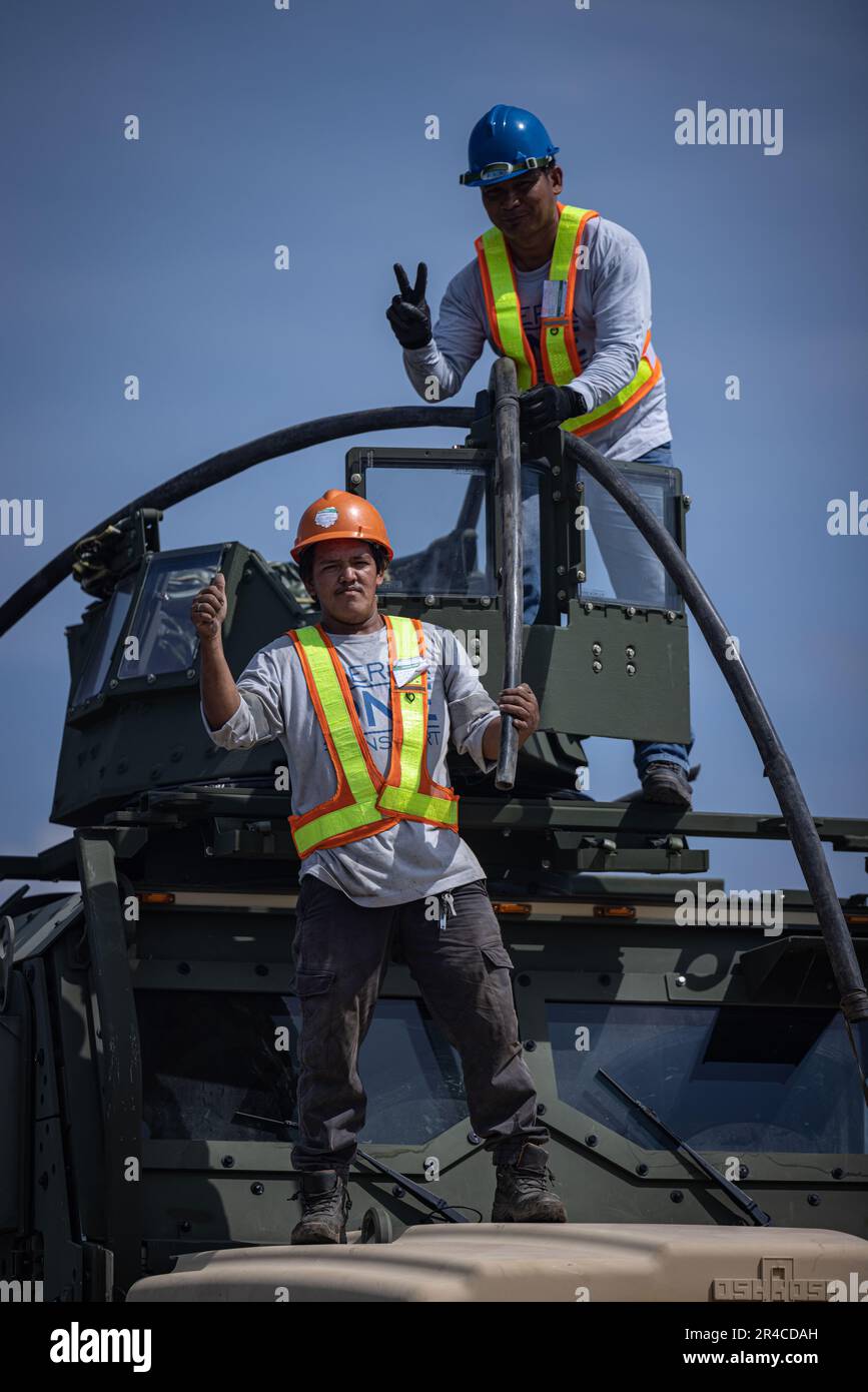 Filipino contractors pose for a photo at Subic Bay International ...