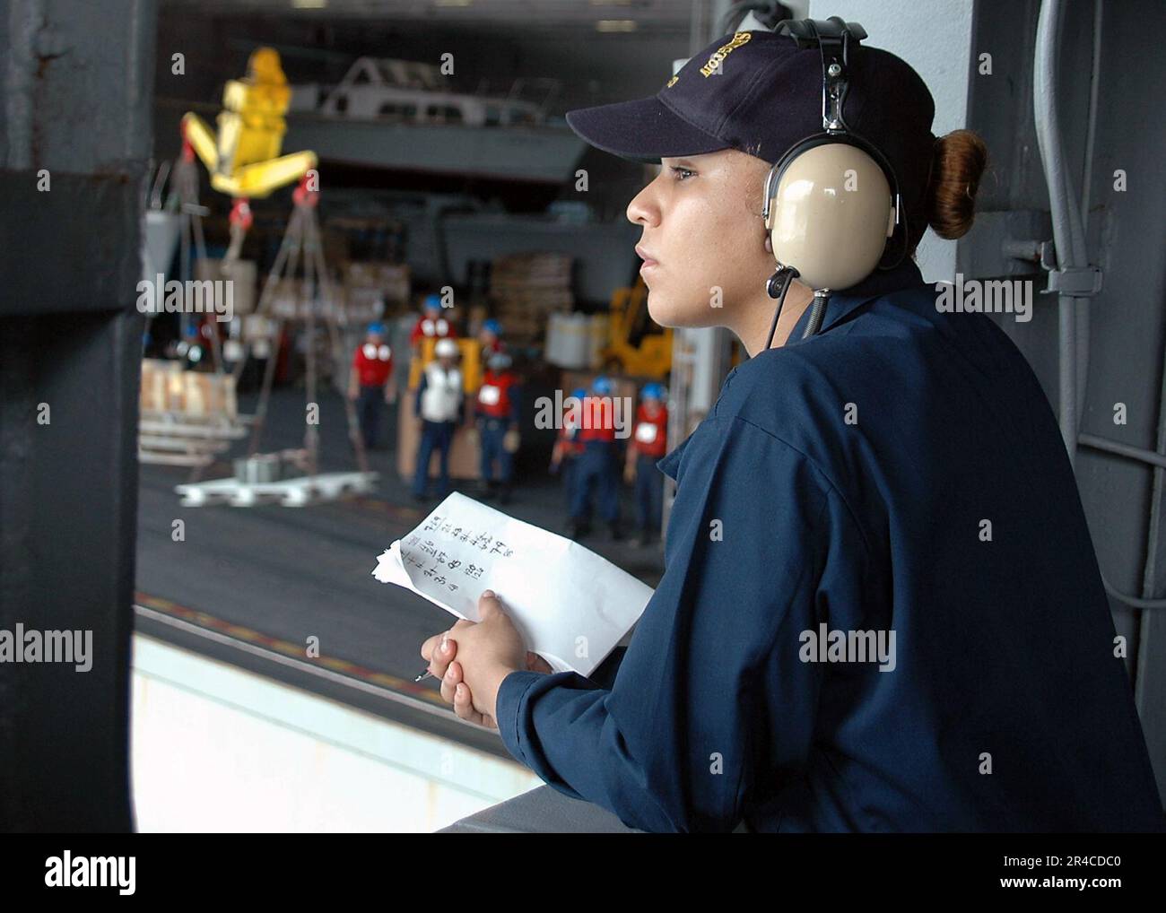 US Navy Engineman Fireman relays messages between the 1st lieutenant ...