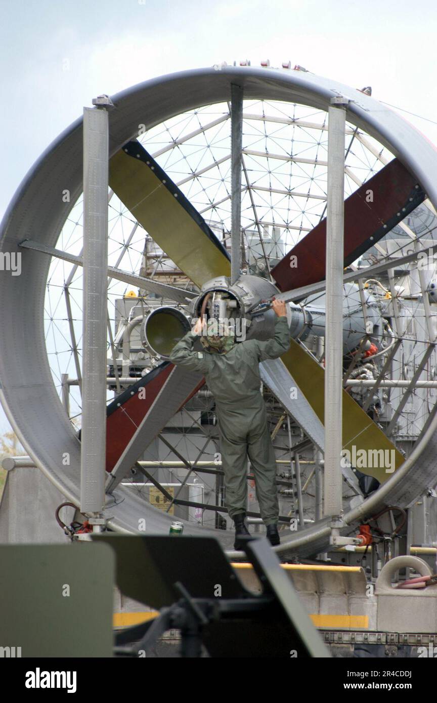US Navy A Sailor assigned to Assault Craft Unit Four (ACU 4) stationed ...