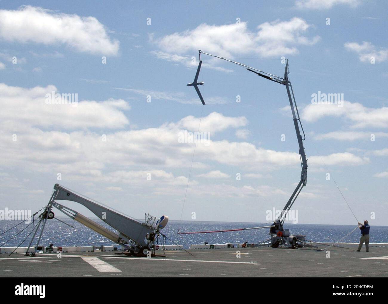 US Navy An Unmanned Aerial Vehicle (UAV) Scan Eagle lands in the ...