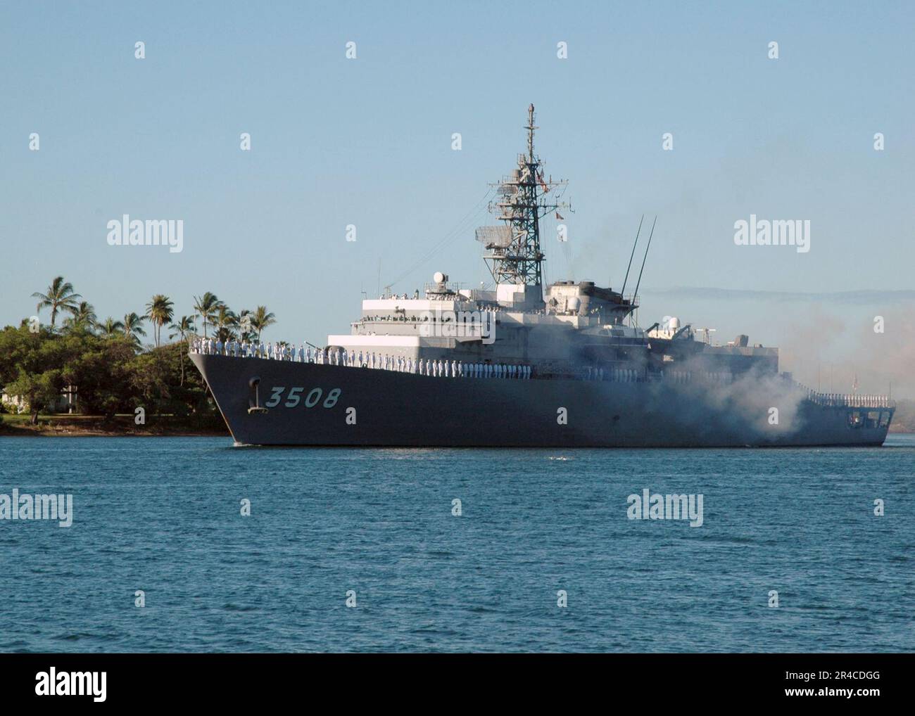 US Navy Sailors stationed aboard JDS Kashima (TV 3508) man the rails ...