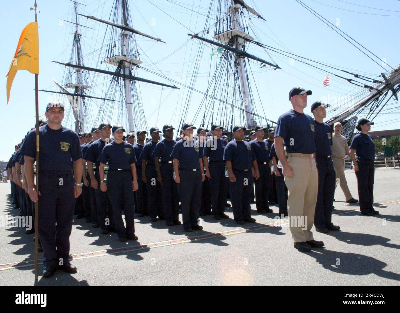 US Navy Chief Petty Officer (CPO) selectees stand in ranks in front of ...