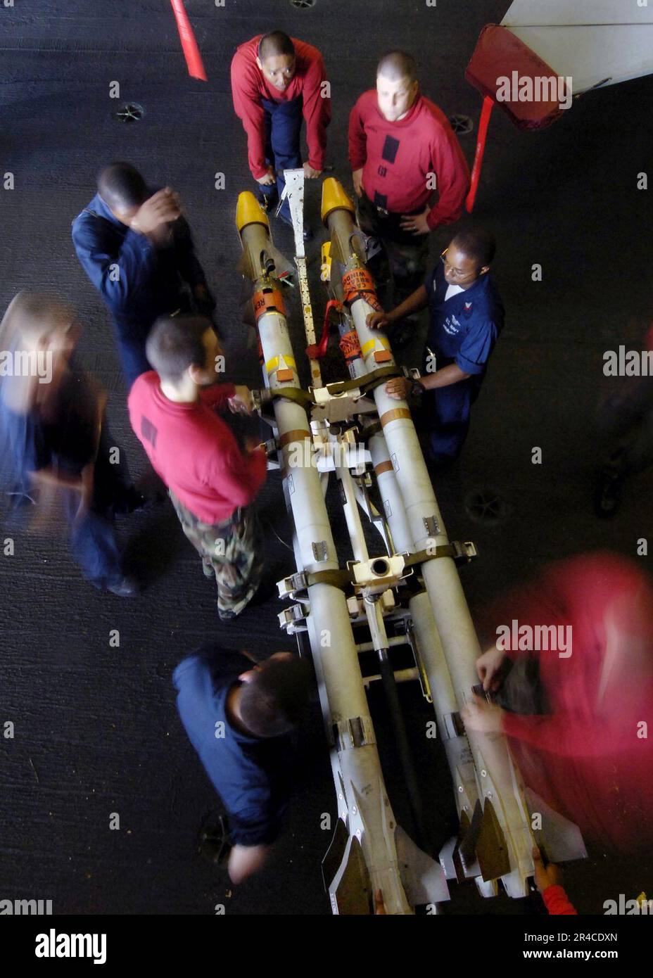 US Navy Aviation ordnancemen stage AIM-9X Sidewinder missiles in the ...