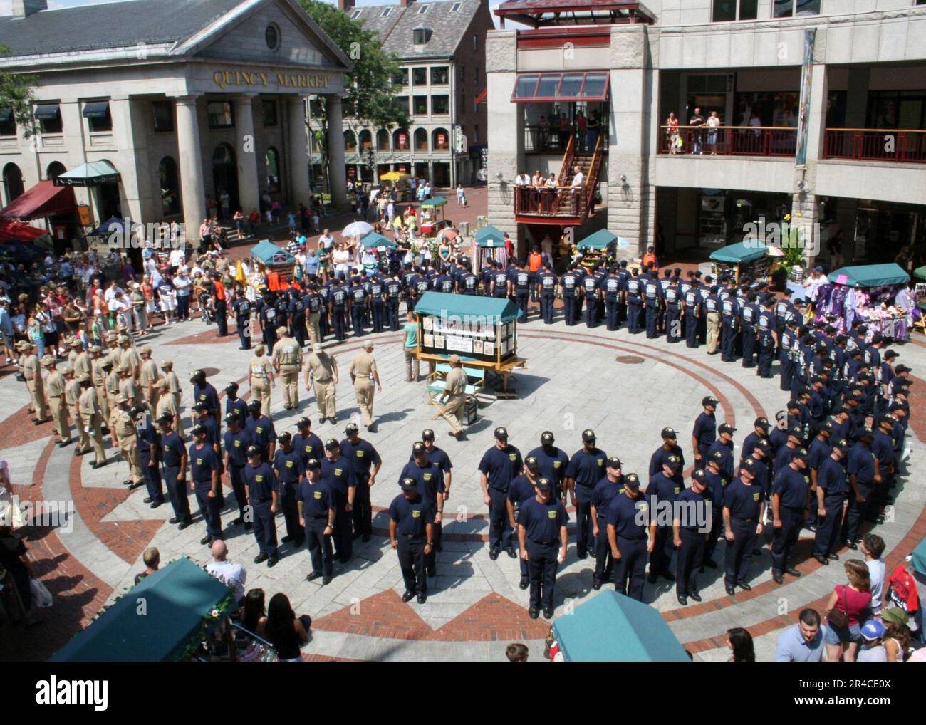 US Navy Chief petty officer (CPO) selectees sing Anchors Away in front ...