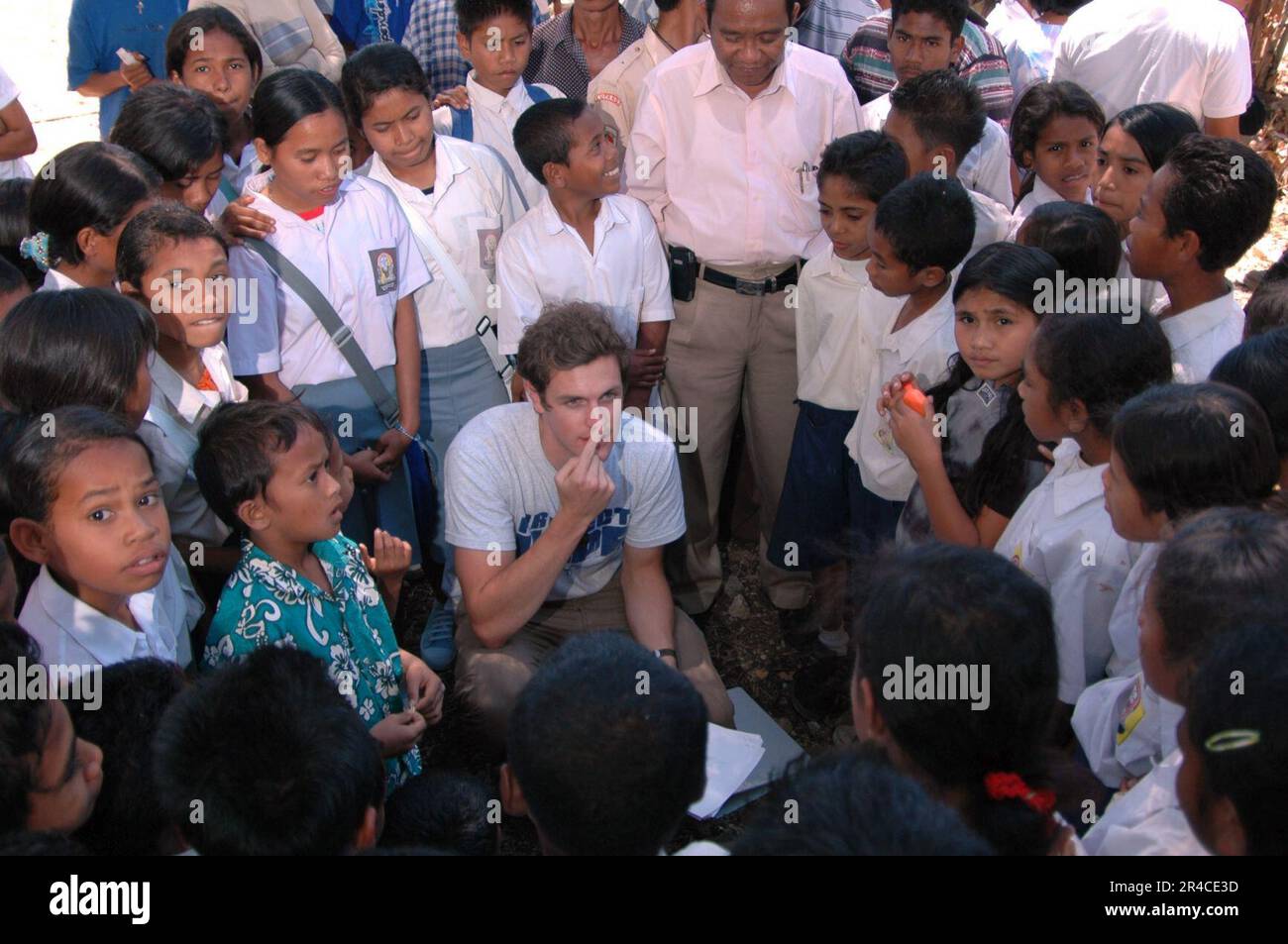 US Navy Project Hope Volunteer teaches local children how to say words ...