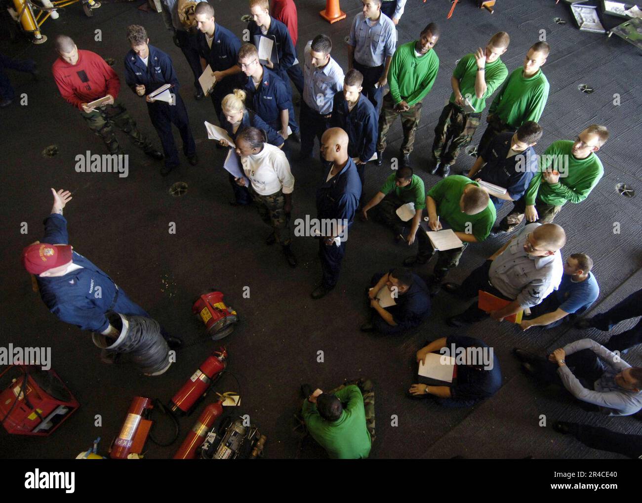 US Navy Damage Controlman 3rd Class explains firefighting equipment ...