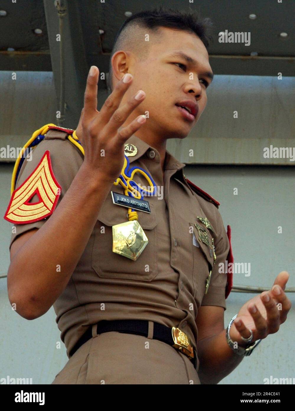 US Navy Mass Communication Specialist Seaman speaks with a cadet from ...