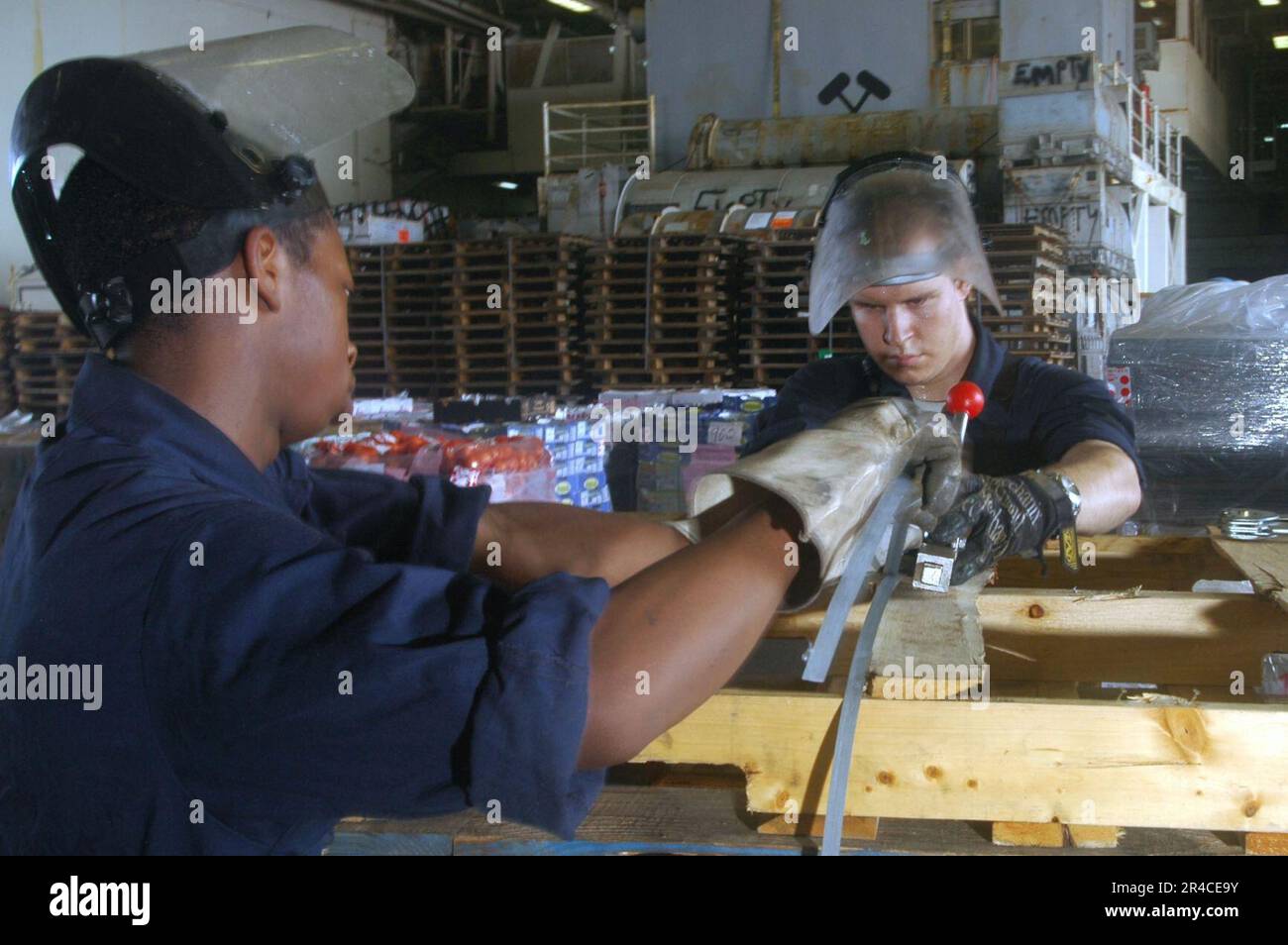US Navy In the ship's hangar bay aboard USS Kitty Hawk (CV 63 ...