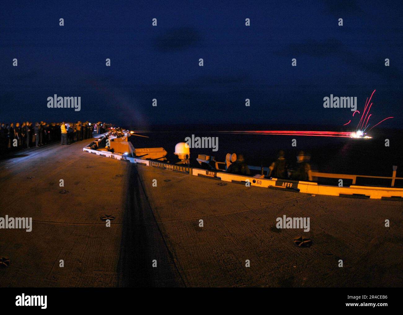 US Navy Sailors observe both M-240 machine gun and a .50 caliber ...