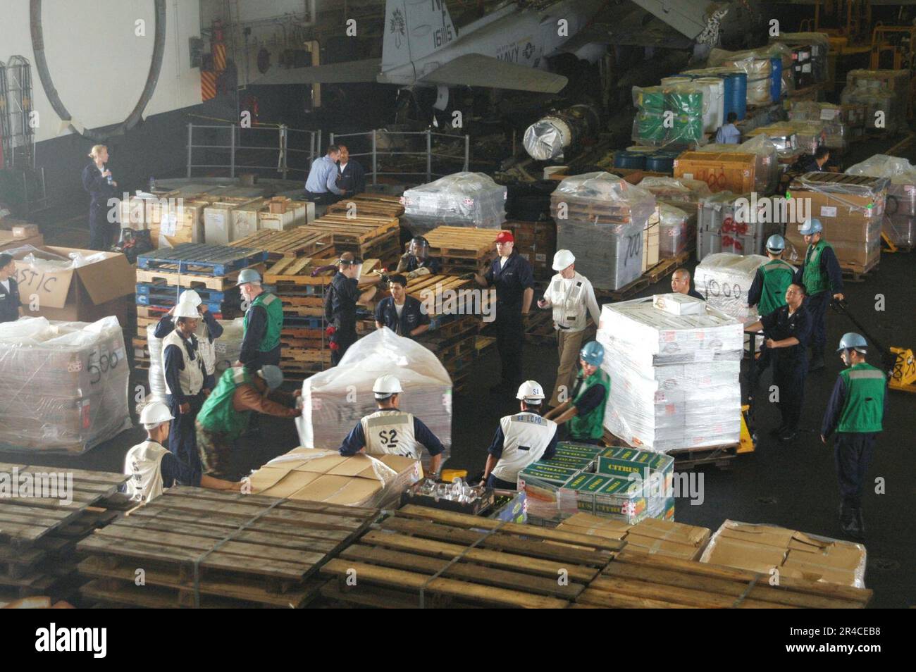 US Navy In the hangar bay aboard USS Kitty Hawk (CV 63), Sailors from ...