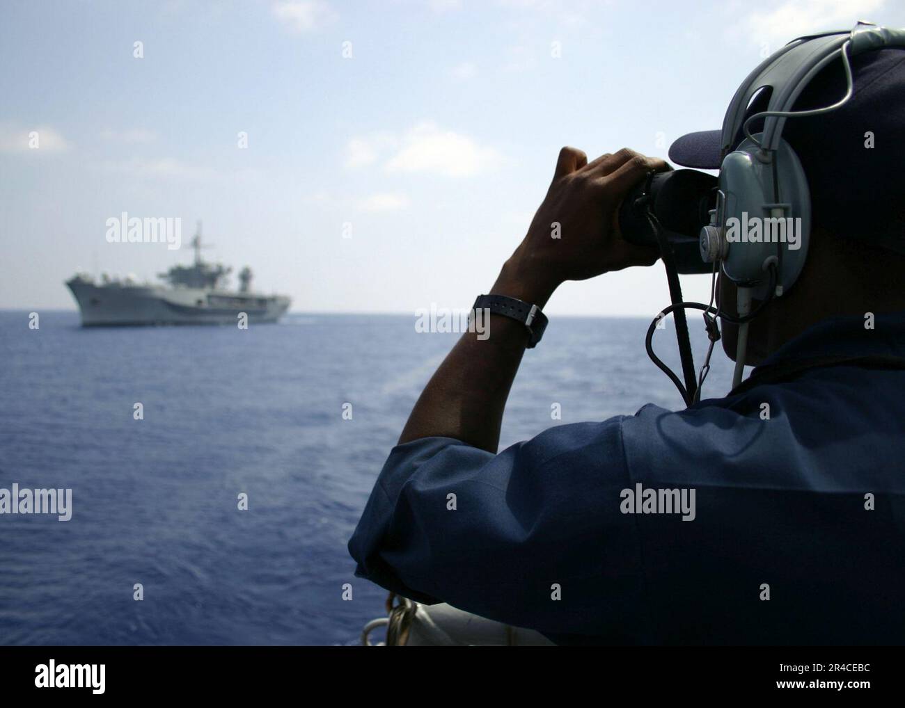 US Navy An aft lookout sights the amphibious command ship and control ...